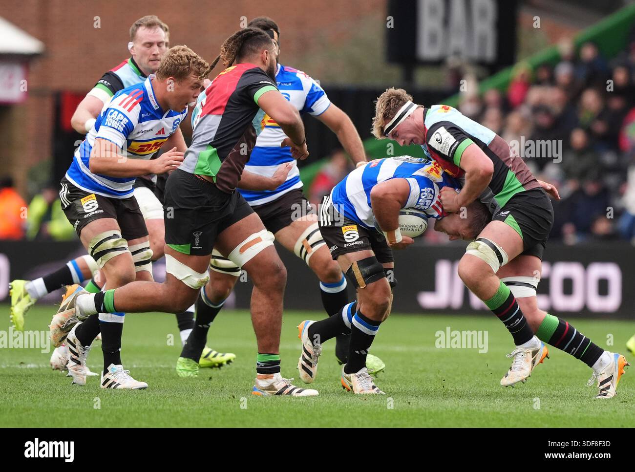 DHL Stormers' Marcel Theunissen (second right) is tackled by Harlequins ...