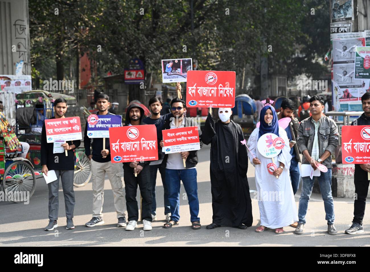 Dhaka, Bangladesh. 11th Jan 2026. Volunteers display a placard during ...