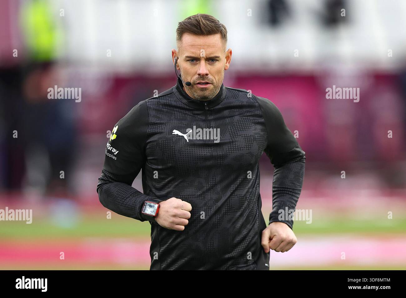 Assistant referee Matthew Smith warming up before the West Ham United v ...