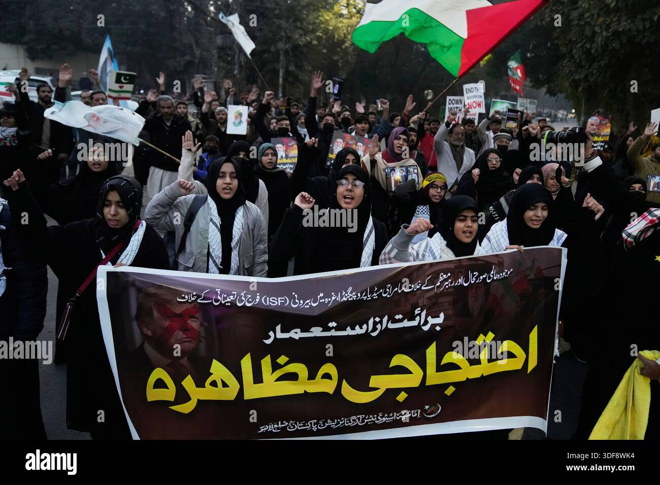 Shiite Muslims chant slogan during a protest against U.S. and show ...