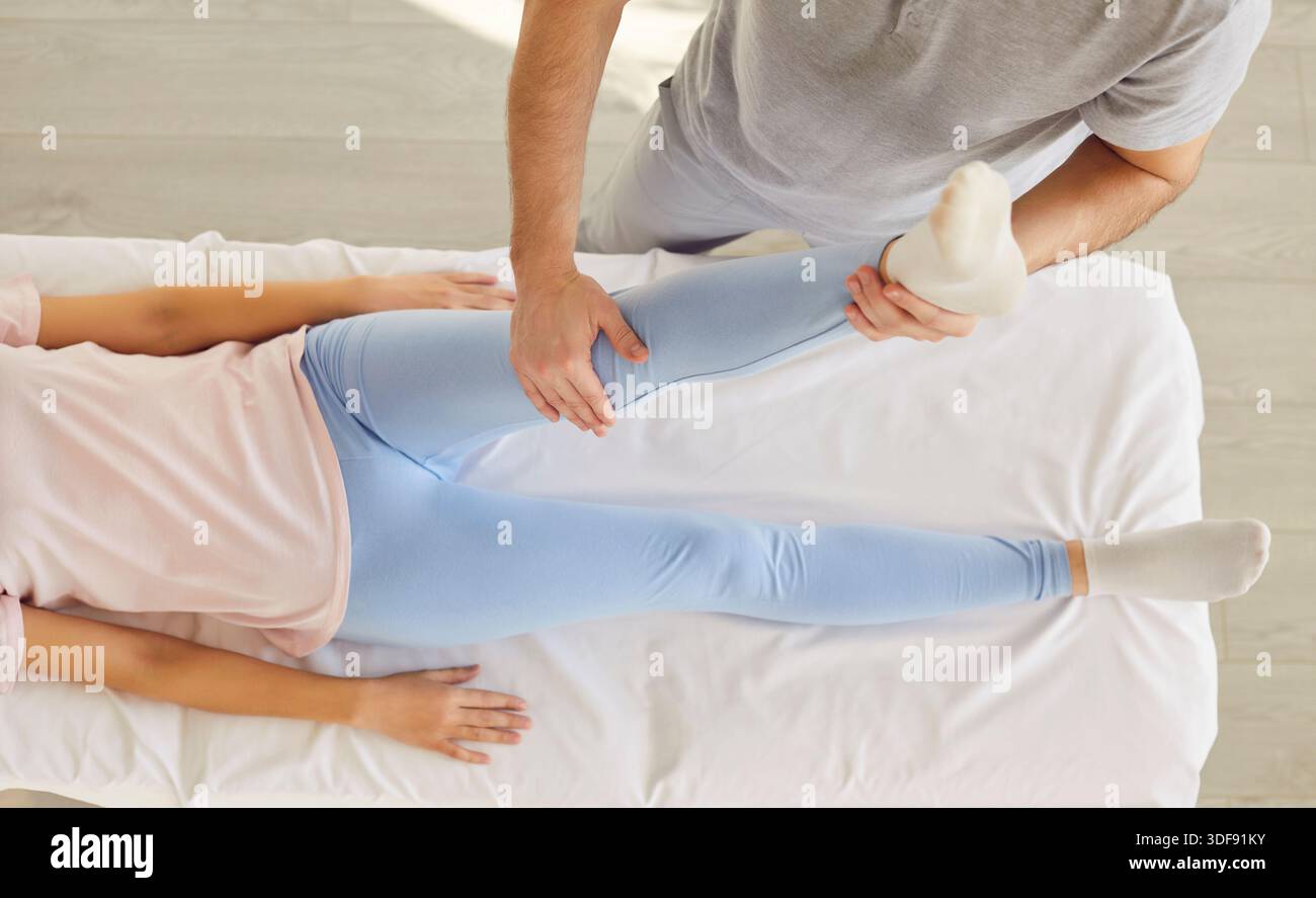 Leg physical therapy, manual rehabilitation, physical therapist doing ...