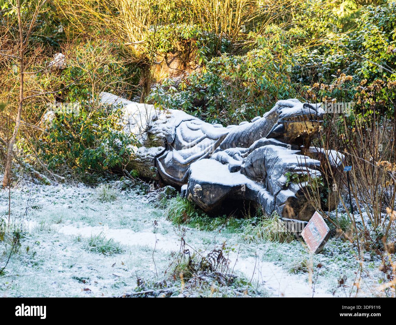 Winter snow on the chainsaw carved dragon sculpture (Ember) at The ...