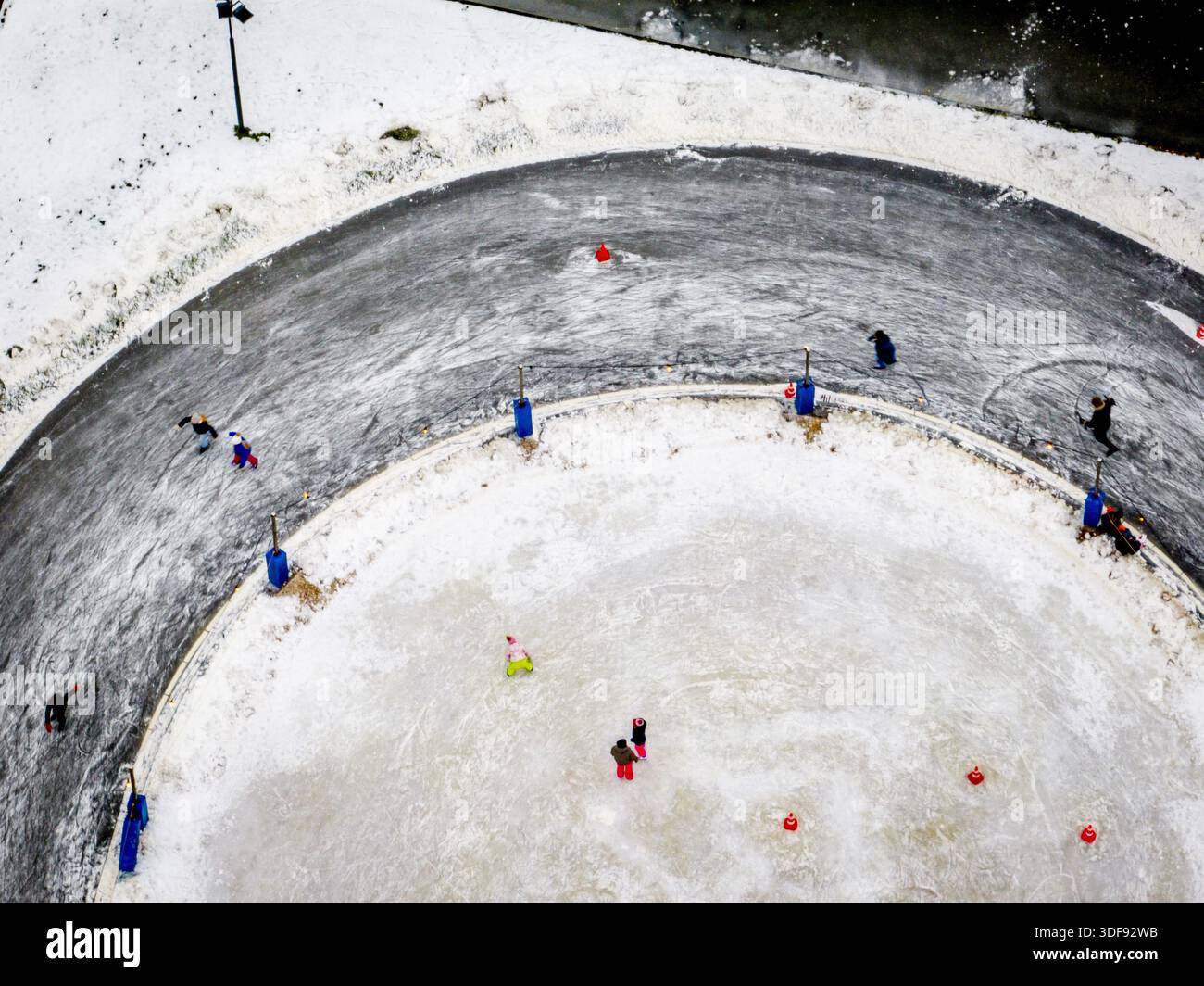 BOSKOOP - People are skating on the natural ice rink. Skating is ...