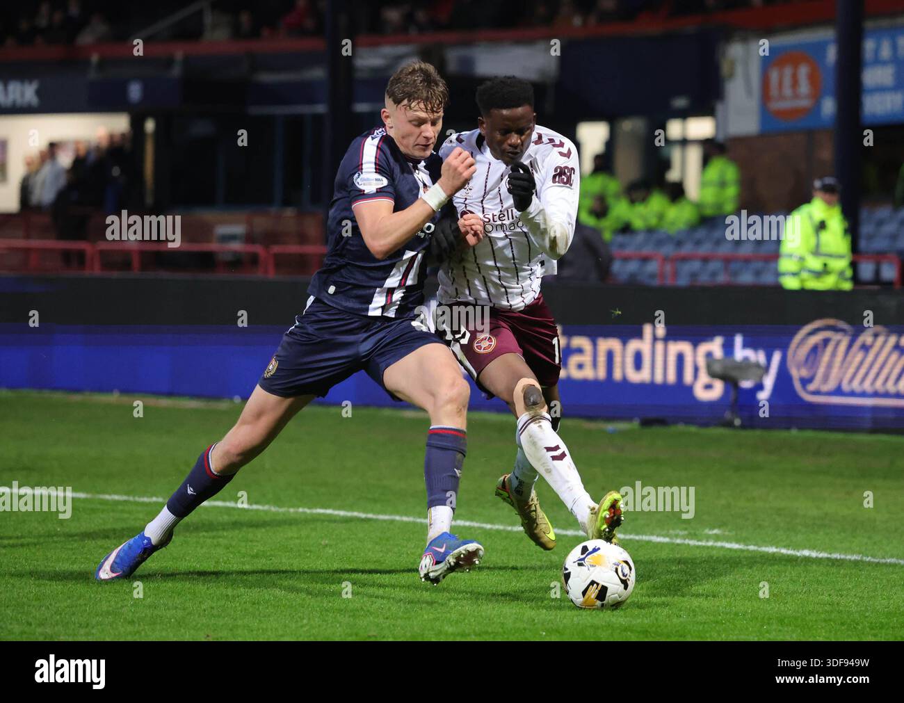 Dundee's Luke Graham (left) and Heart of Midlothian's Pierre Landry ...