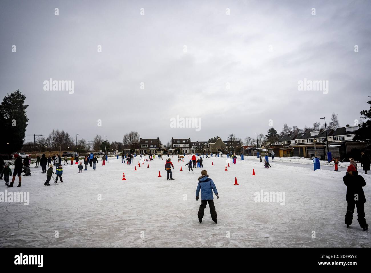 BOSKOOP - People are skating on the natural ice rink. Skating is ...