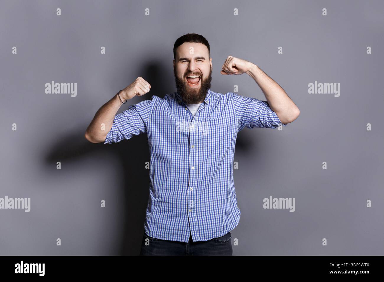 Delighted bearded man expressing hi-res stock photography and images ...