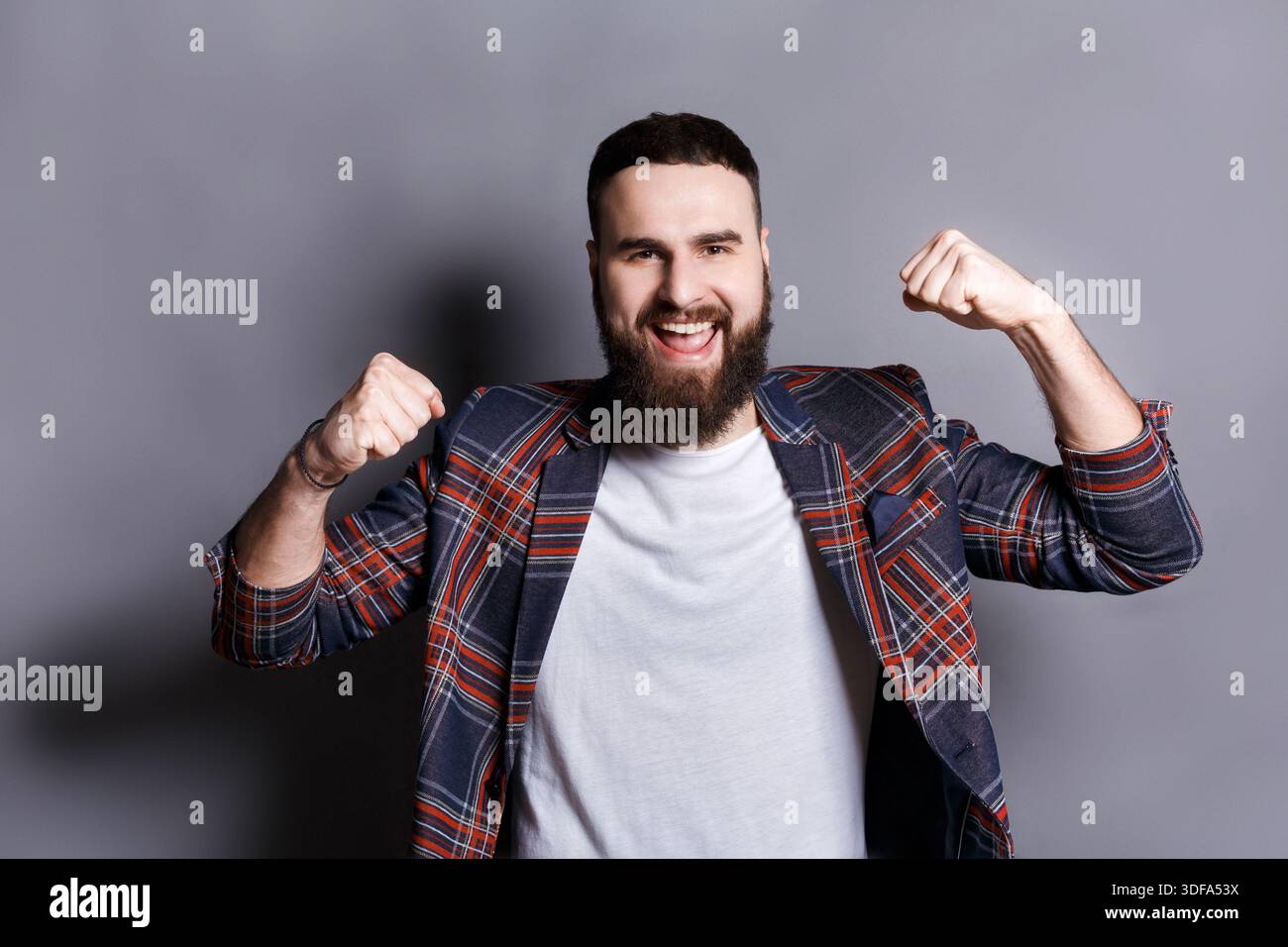Delighted bearded man expressing hi-res stock photography and images ...