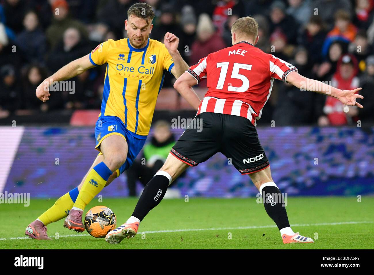 Rhys Oates of Mansfield Town takes on Ben Mee of Sheffield United ...