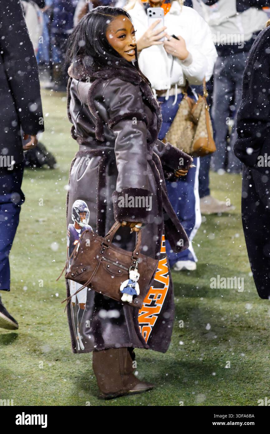 Simone Biles before an NFL wild-card football game against the Green ...
