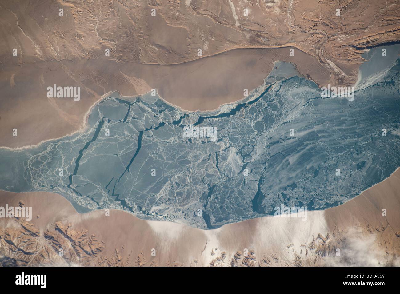 An icy lake in southwestern China’s high plateau region north of the ...