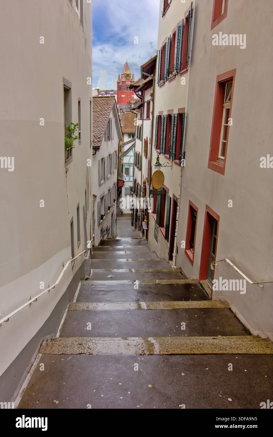 A narrow stair street between historic houses in Basel showing depth ...