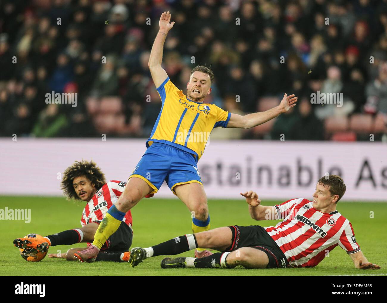 Rhys Oates of Mansfield Town is fouled by Tahith Chong of Sheffield ...