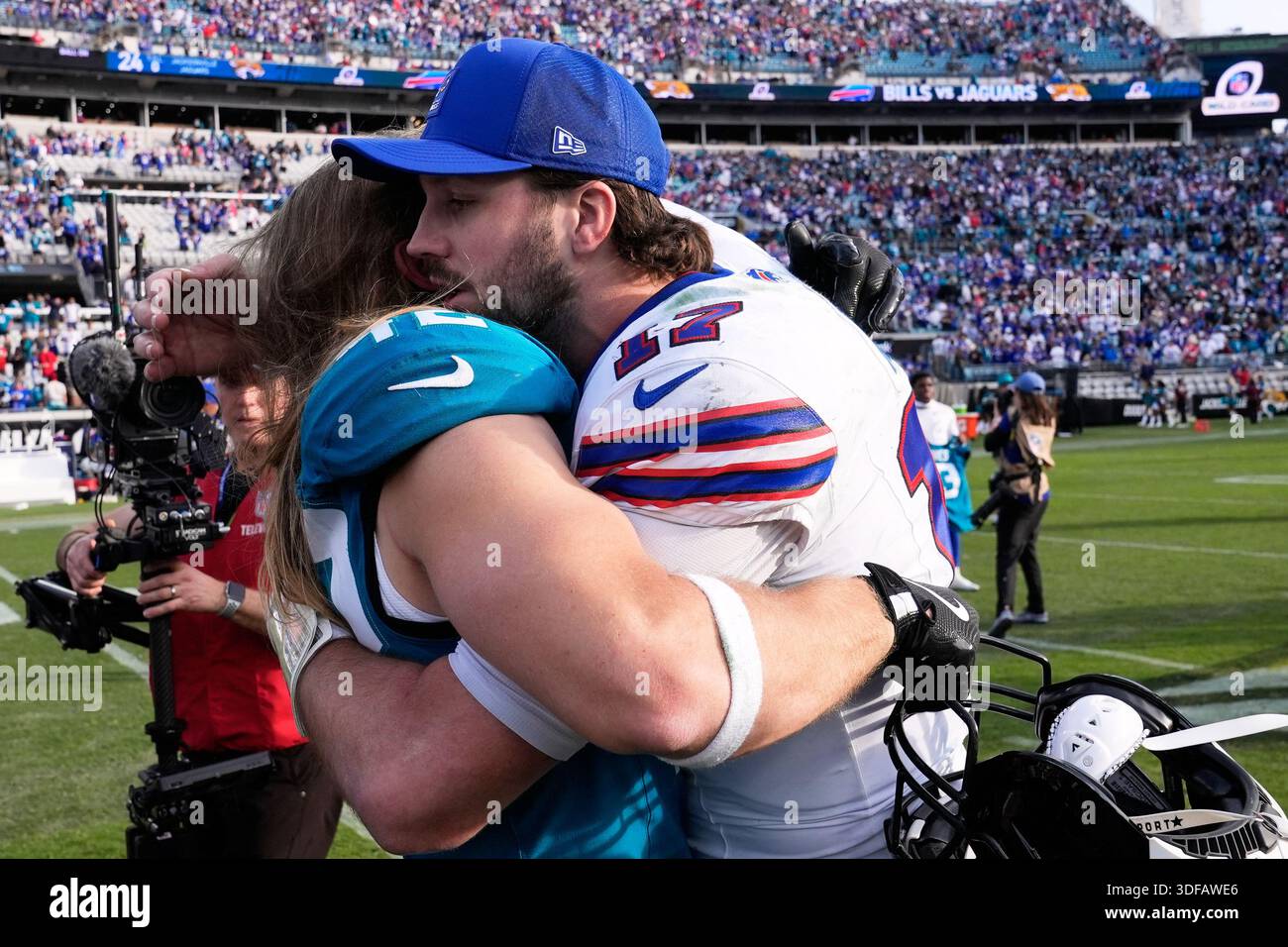 Jacksonville Jaguars safety Andrew Wingard, left, hugs Buffalo Bills ...