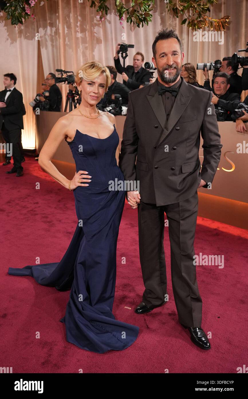 Sara Wells, left, and Noah Wyle arrive at the 83rd Golden Globes on ...