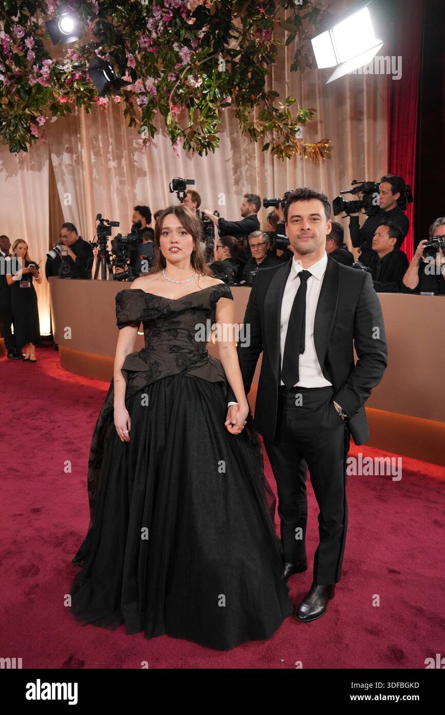Aimee Lou Wood, left, and Adam Long arrive at the 83rd Golden Globes on ...