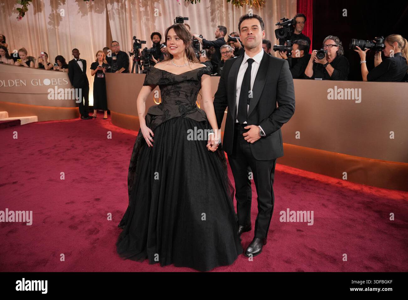 Aimee Lou Wood, left, and Adam Long arrive at the 83rd Golden Globes on ...
