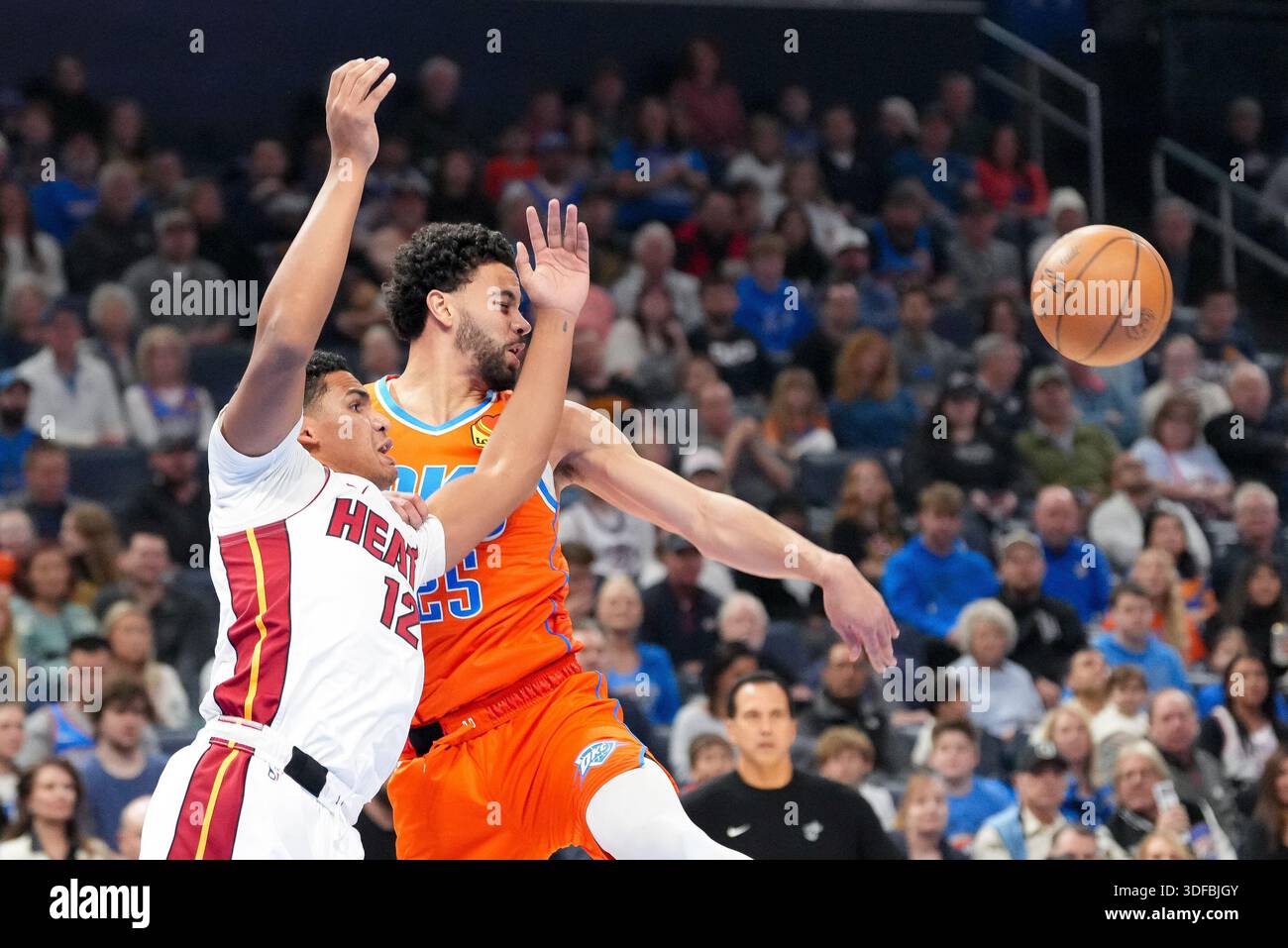 Miami Heat guard Dru Smith, left, tries to get to a rebound before ...