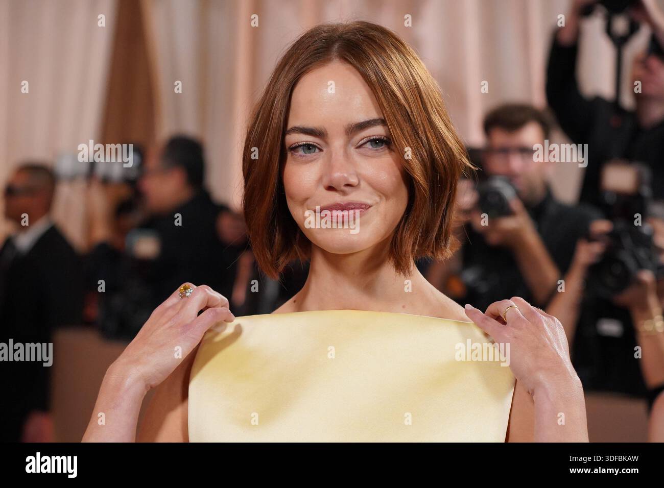 Emma Stone arrives at the 83rd Golden Globes on Sunday, Jan. 11, 2026 ...