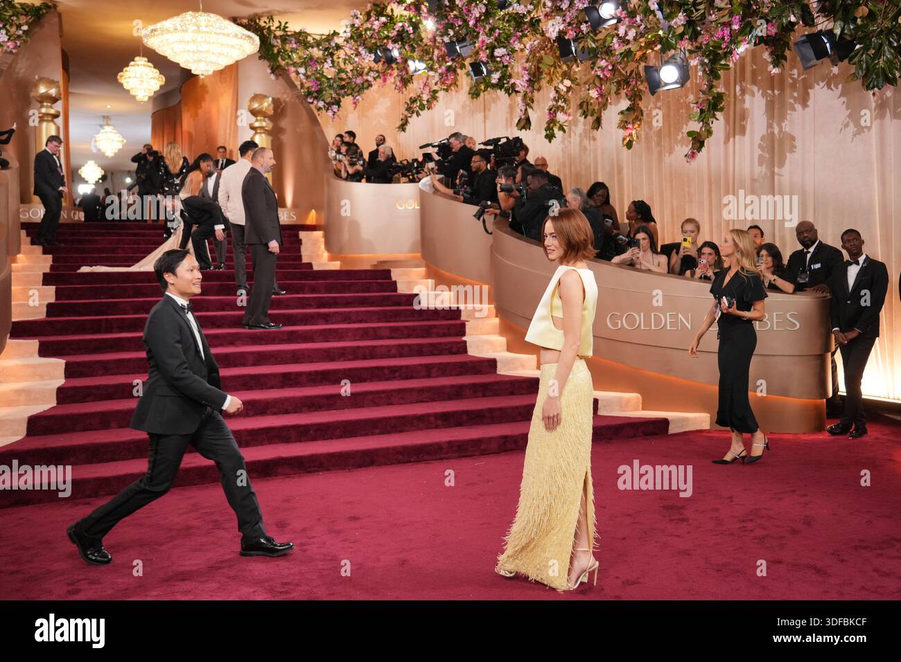 Emma Stone arrives at the 83rd Golden Globes on Sunday, Jan. 11, 2026 ...