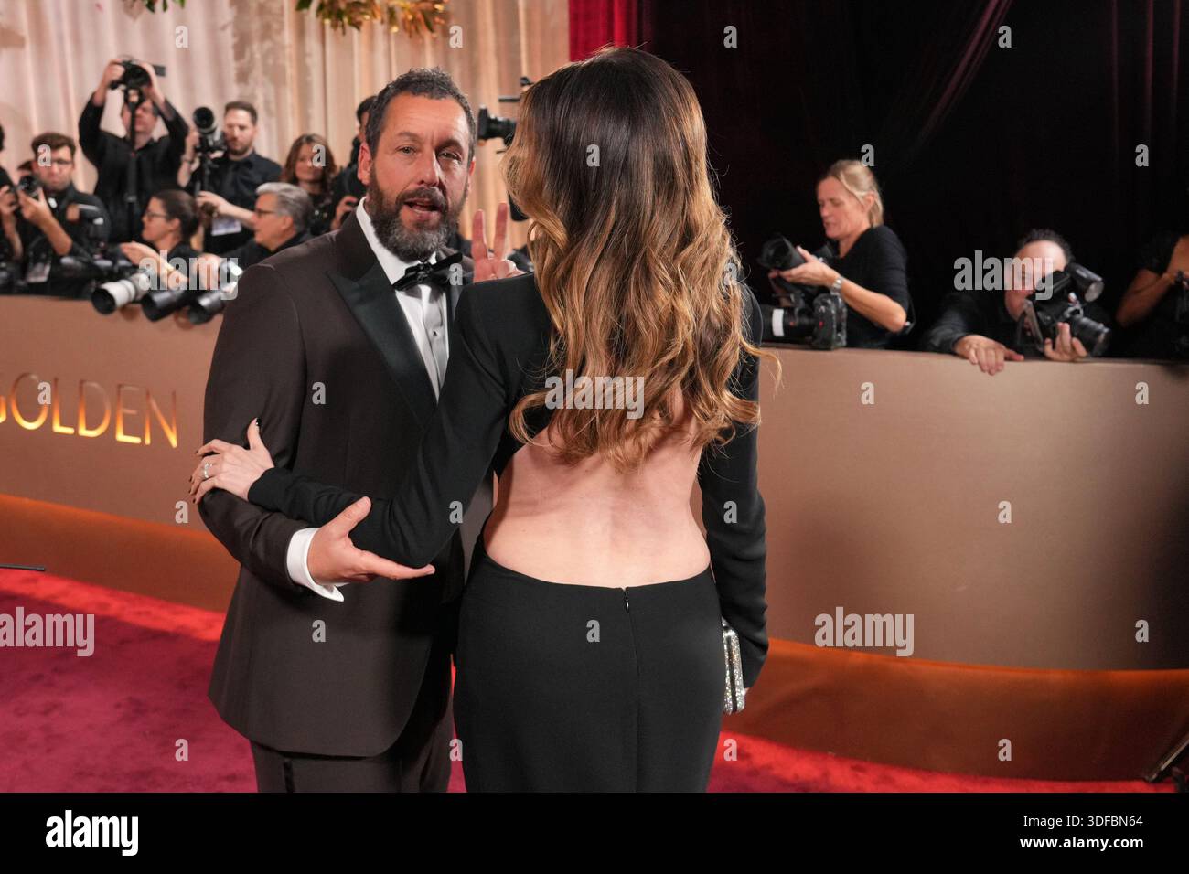 Adam Sandler, left, and Jackie Sandler arrive at the 83rd Golden Globes ...