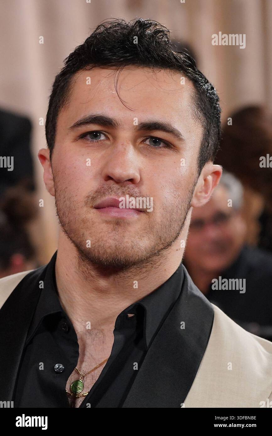 Chris Olsen arrives at the 83rd Golden Globes on Sunday, Jan. 11, 2026 ...