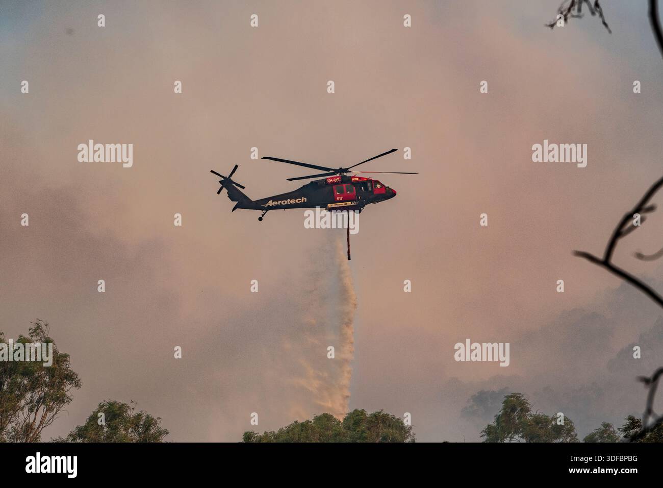 Helicopters drop water on a fire burning in Creightons Creek. (Photo by ...