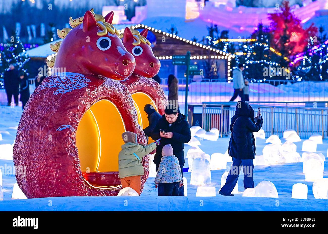 HOHHOT, CHINA - JANUARY 11, 2026 - Tourists play in an ice and snow ...