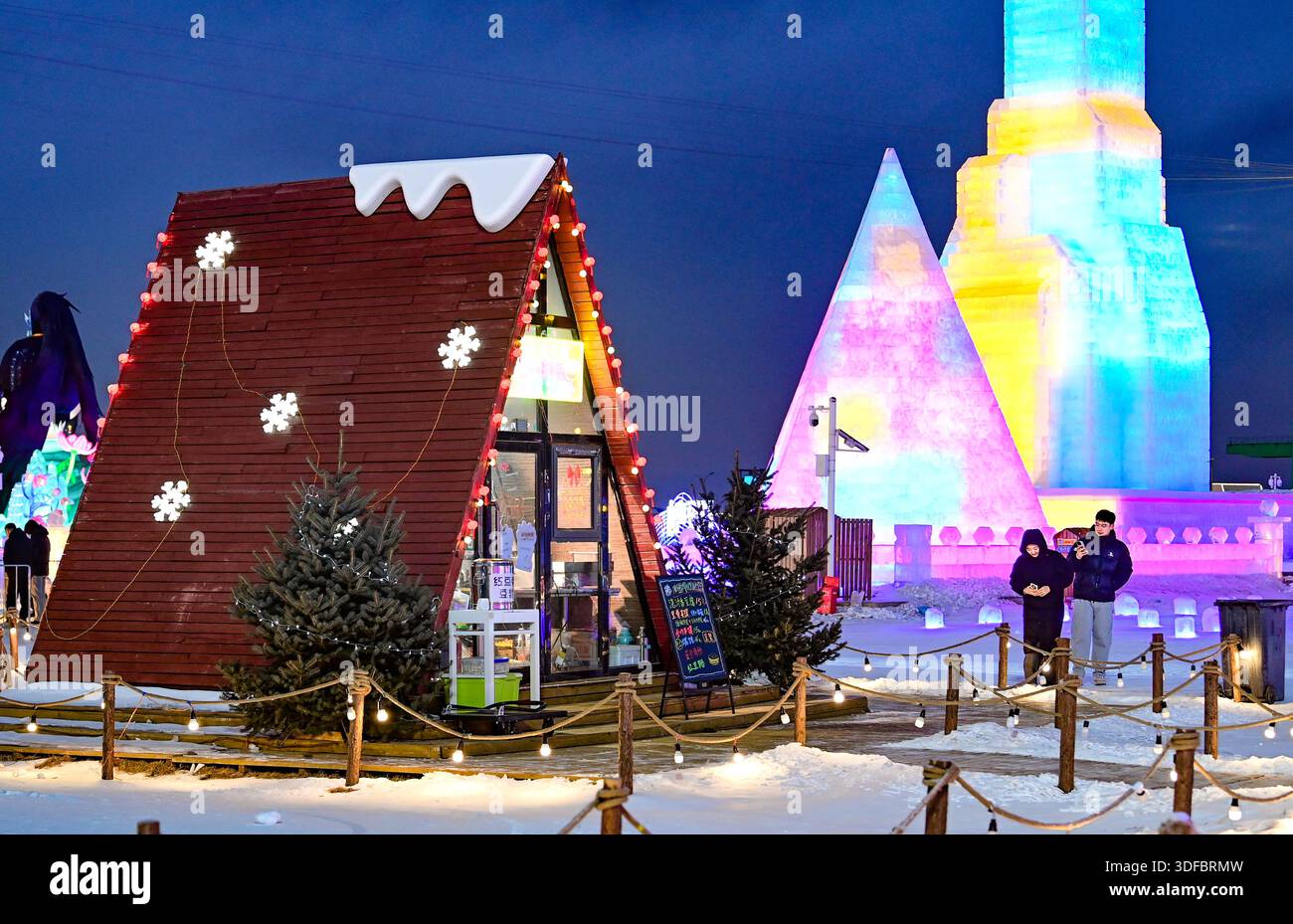 HOHHOT, CHINA - JANUARY 11, 2026 - Tourists play in an ice and snow ...