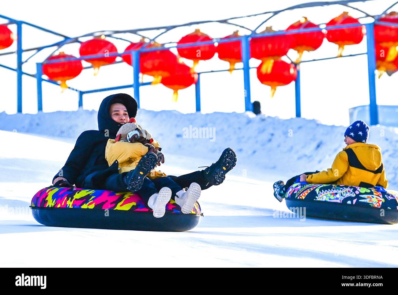 HOHHOT, CHINA - JANUARY 11, 2026 - Tourists experience skiing circles ...