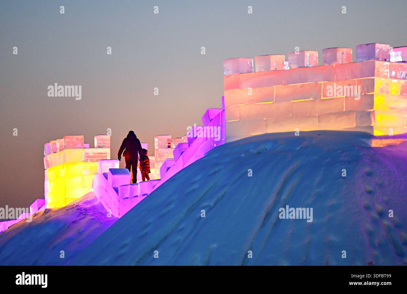 HOHHOT, CHINA - JANUARY 11, 2026 - Tourists play in an ice and snow ...
