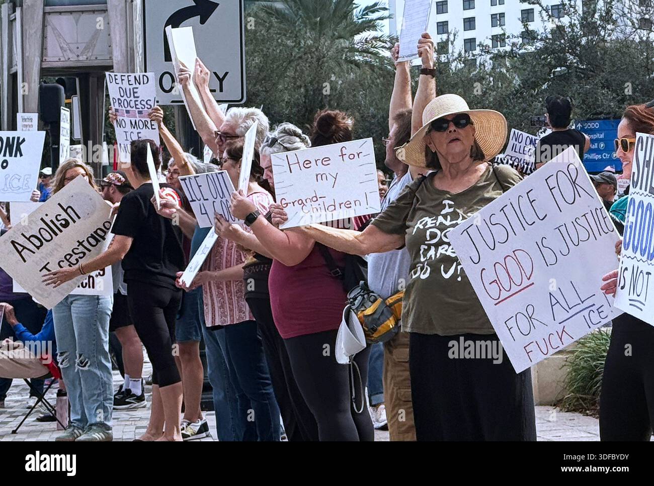 (EDITORS NOTE: Image contains profanity) Several protesters hold ...