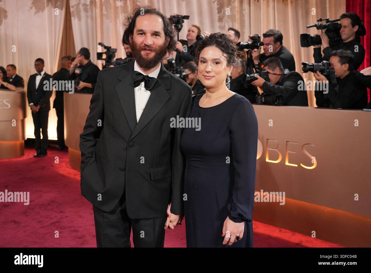 Josh Safdie, left, and Sara Rossein arrive at the 83rd Golden Globes on ...