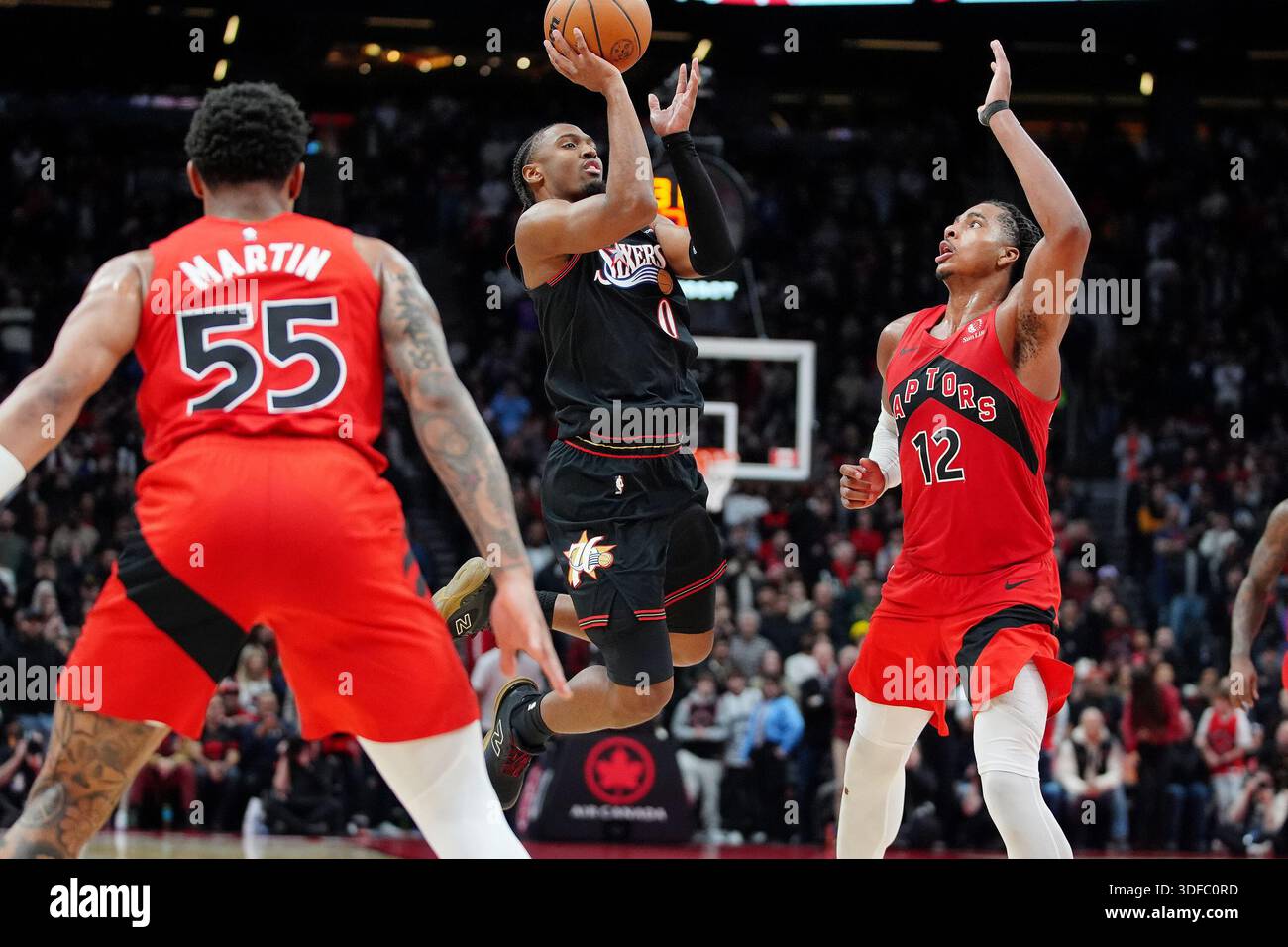 Toronto Raptors forward Collin Murray-Boyles (12) watches as ...