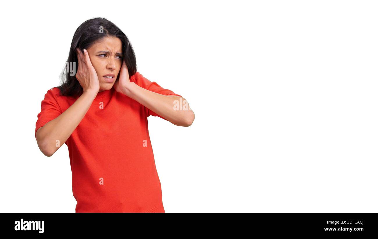 Woman covering ears blocking loud noise Stock Photo - Alamy