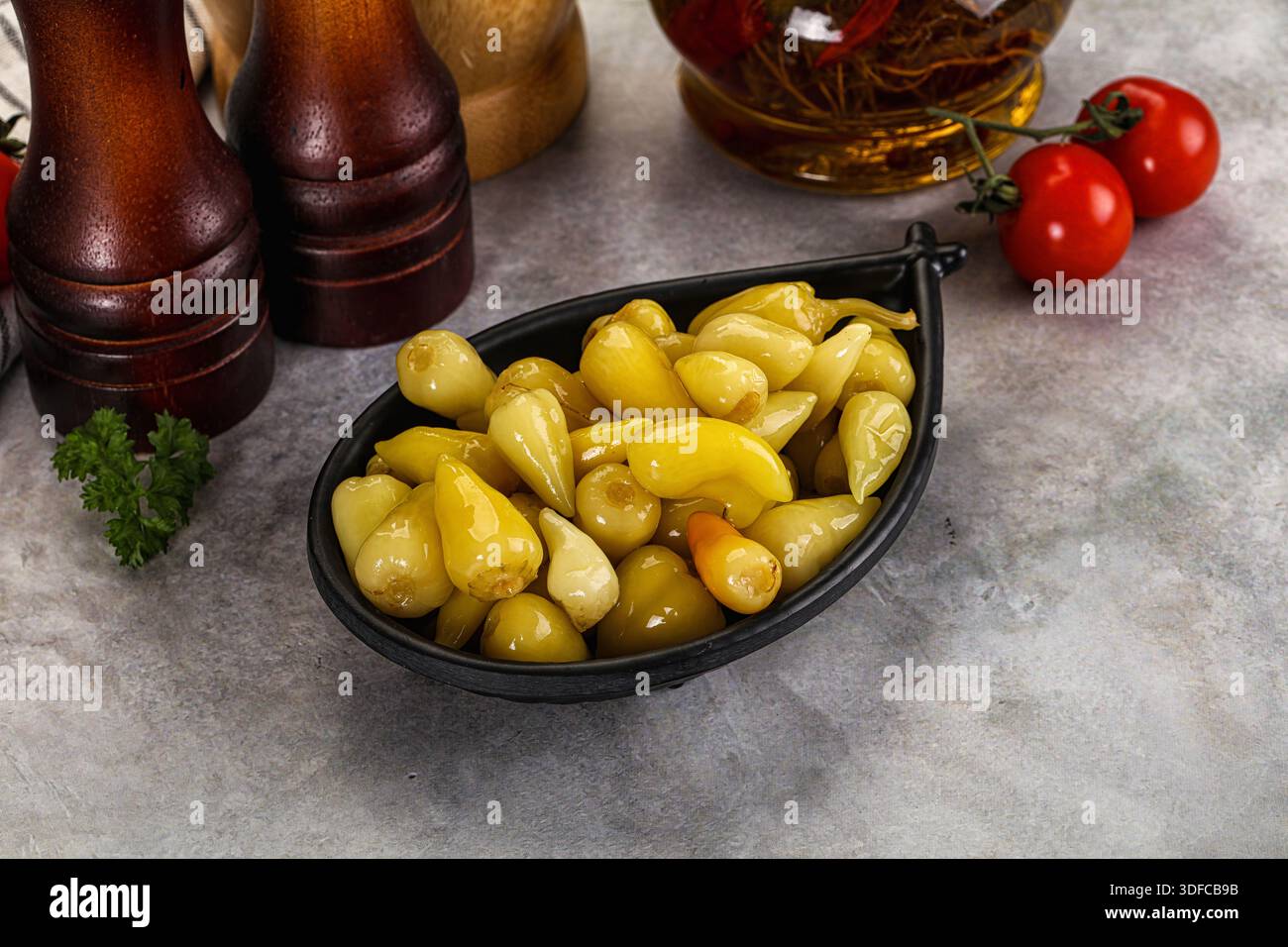Turkish traditional marinated mini yellow chili peppers Stock Photo - Alamy