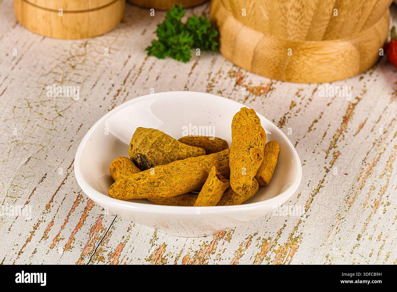 Raw dry Tumeric roots heap for culinary and medicine Stock Photo - Alamy