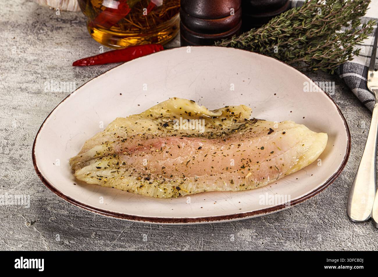 Baked tilapia fish fillet with spices Stock Photo - Alamy