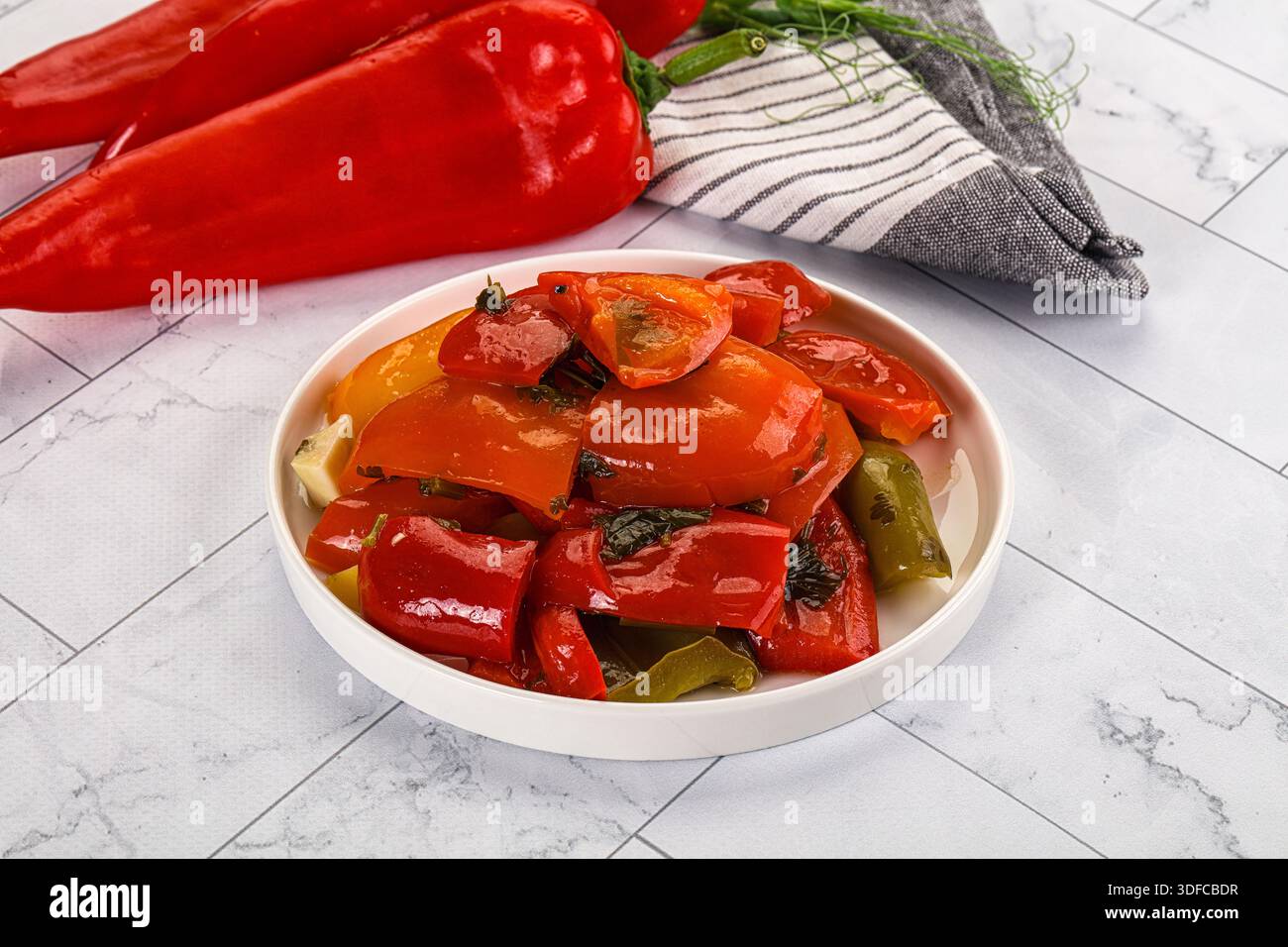 Marinated bell pepper paprika snack in the bowl Stock Photo - Alamy
