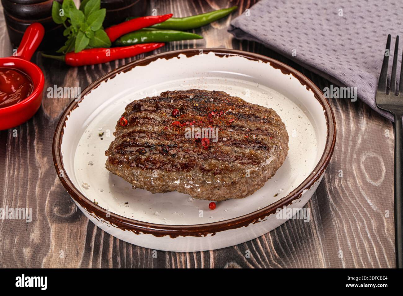 Grilled beef burger cutlet with tomato sauce Stock Photo - Alamy
