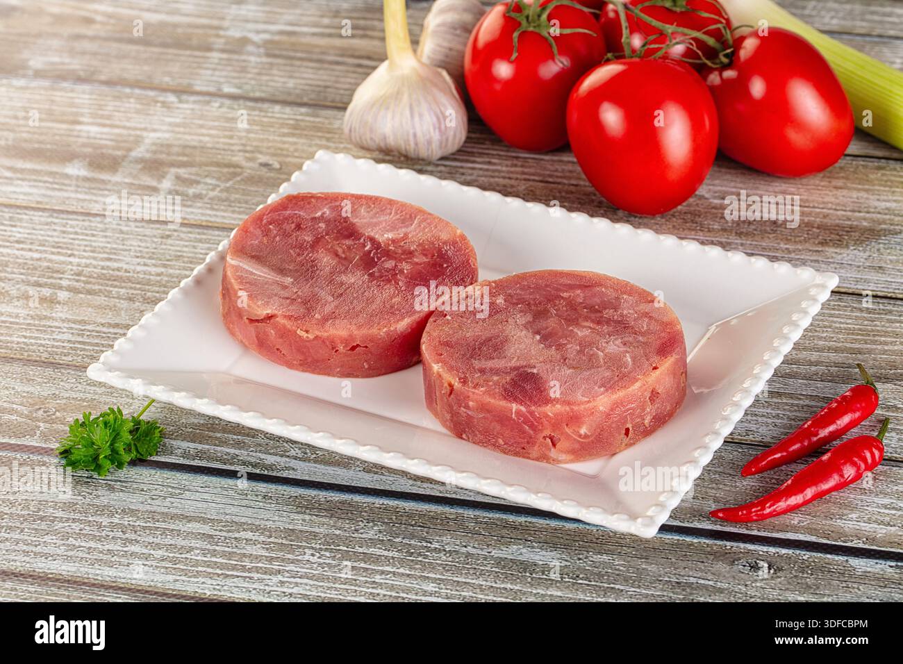 Raw round tuna fish uncucked fillet Stock Photo - Alamy