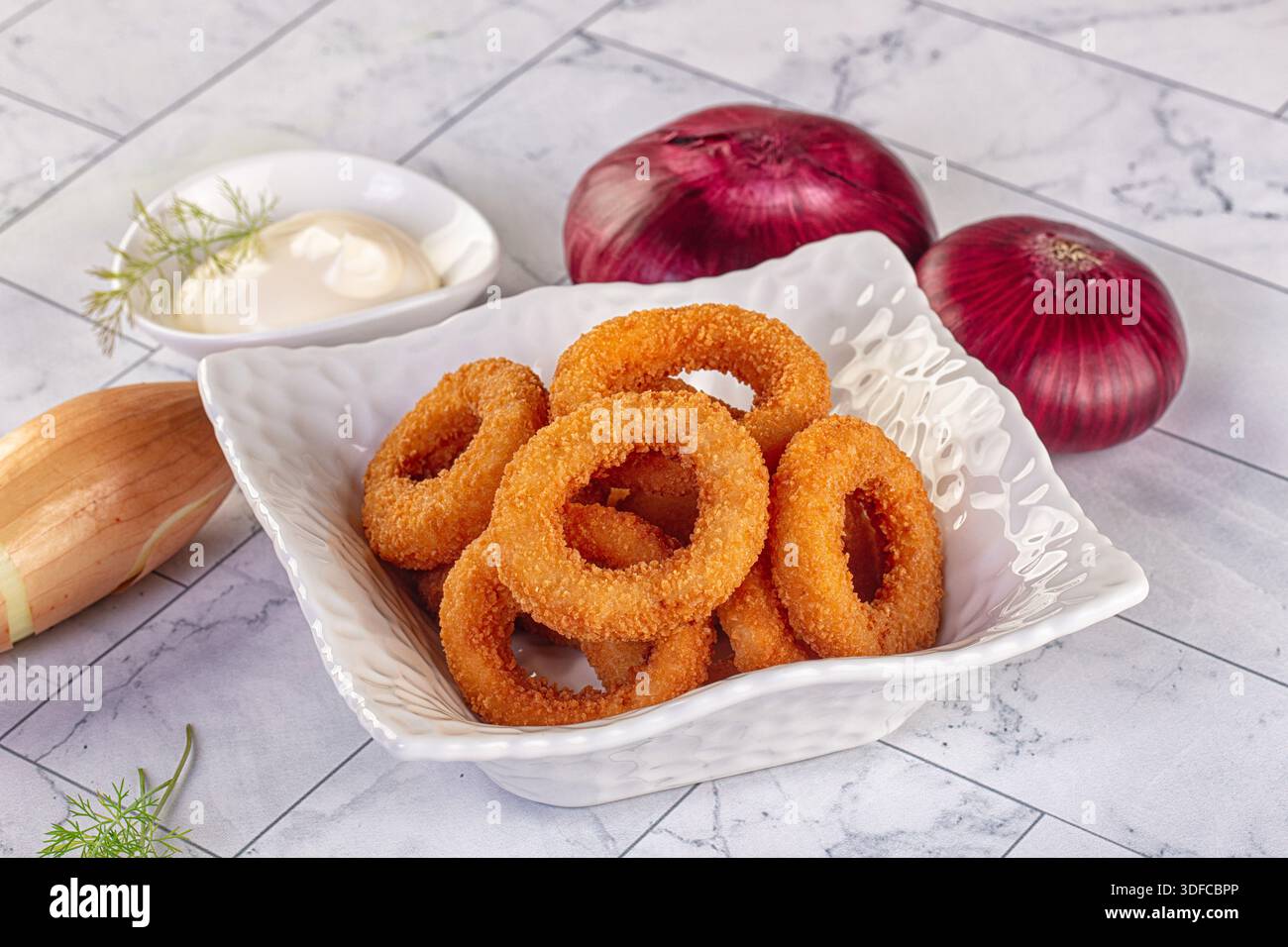 Golden fried breaded onion rings snack Stock Photo - Alamy