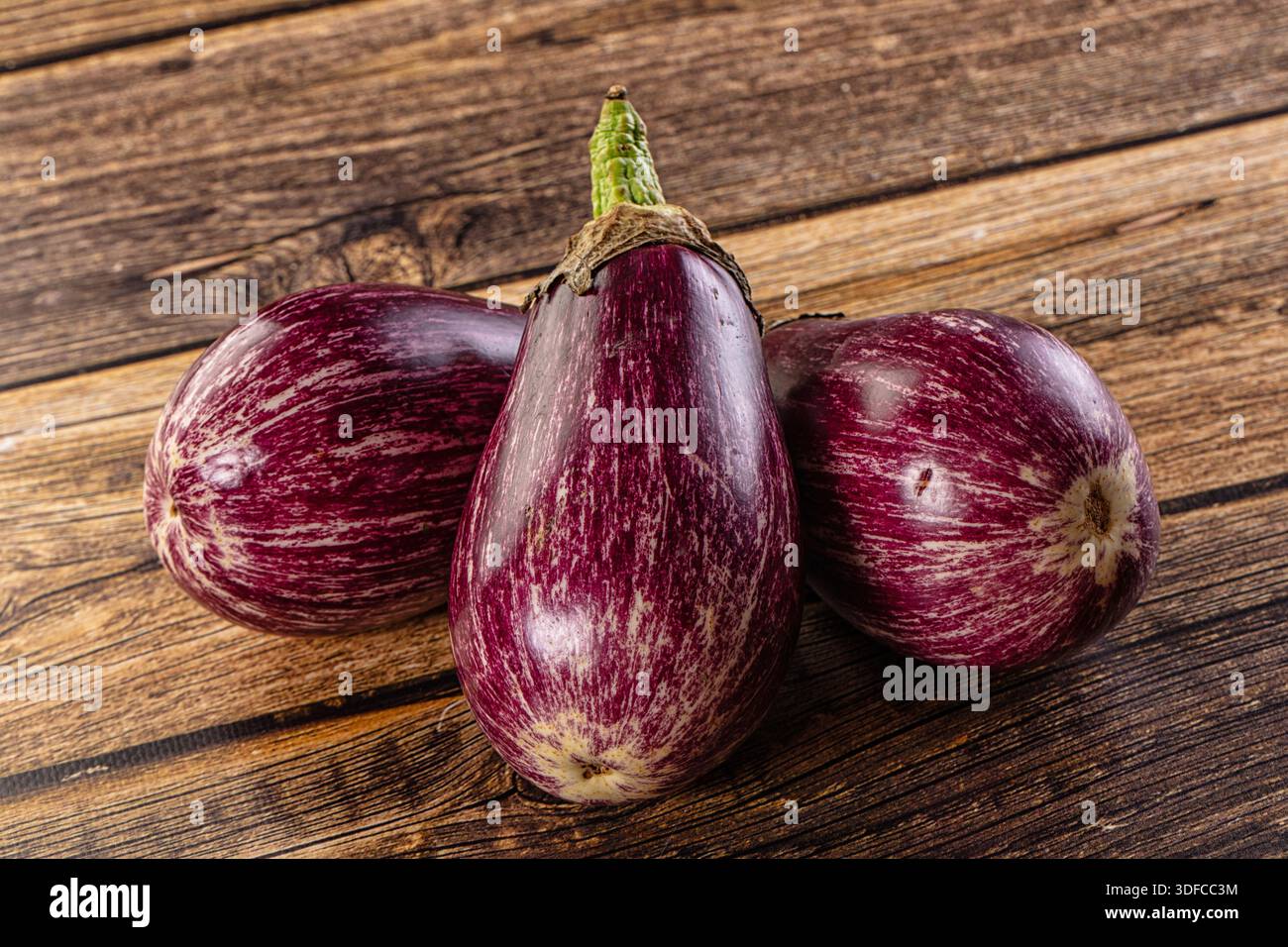 Stripped violet graffiti eggplant vegetable for cooking Stock Photo - Alamy