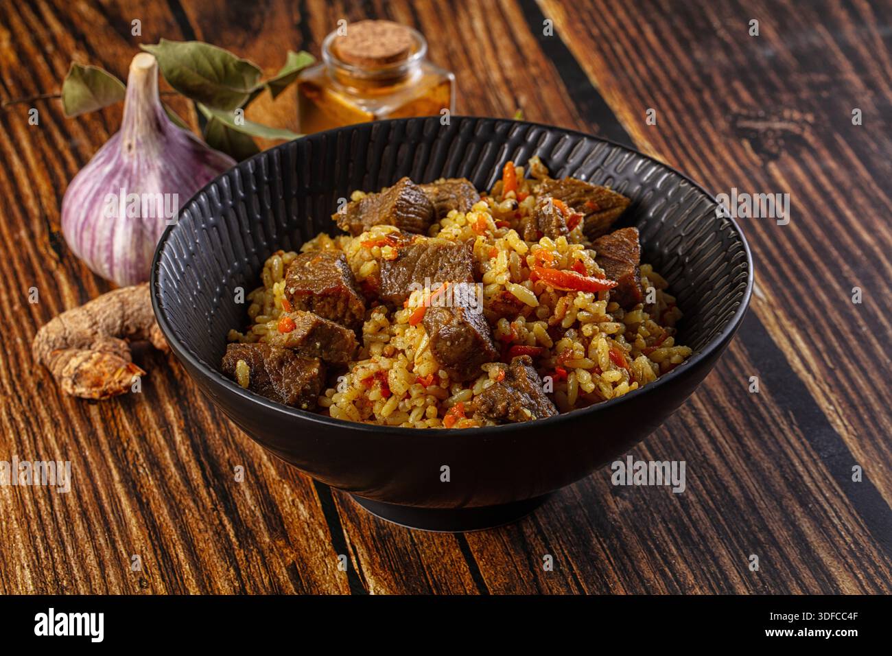 Asian traditional pilaf with beef and carrot Stock Photo - Alamy