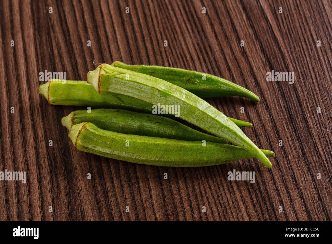 Raw organic green okra vegetable for vegan cuisine Stock Photo - Alamy