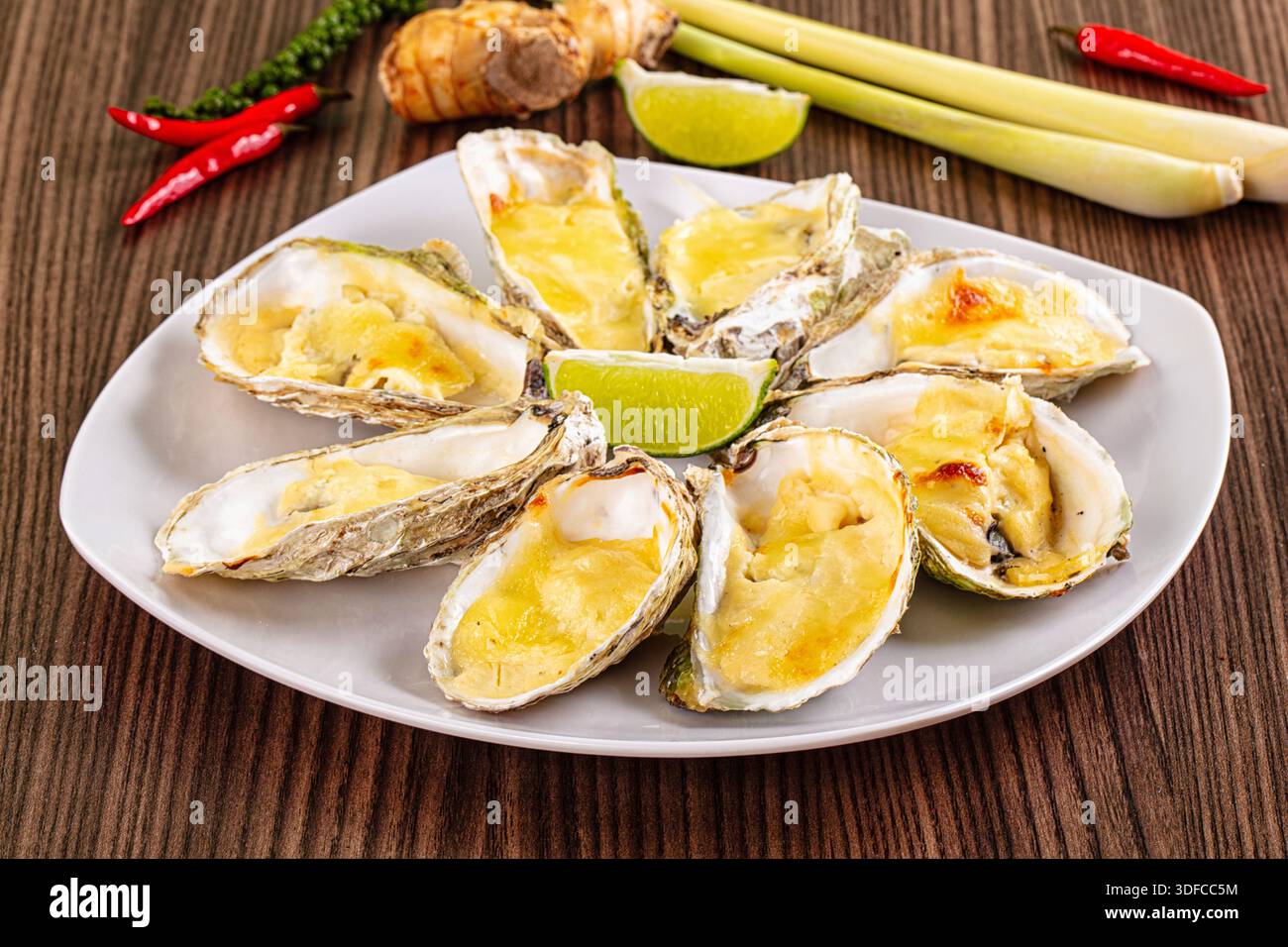 Gourmet baked oysters with parmesan cheese Stock Photo - Alamy