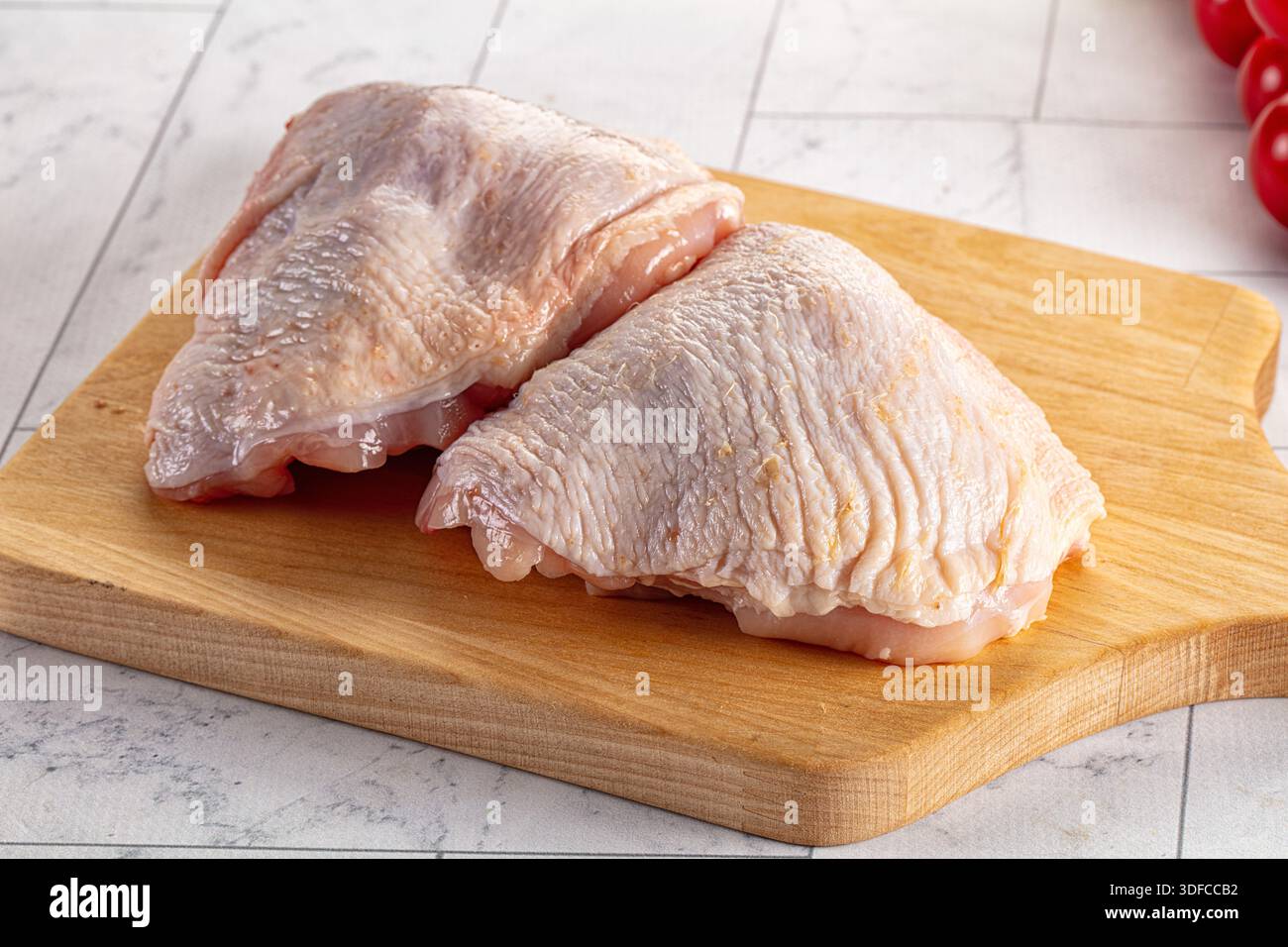 Raw chicken thighs for cooking over board Stock Photo - Alamy