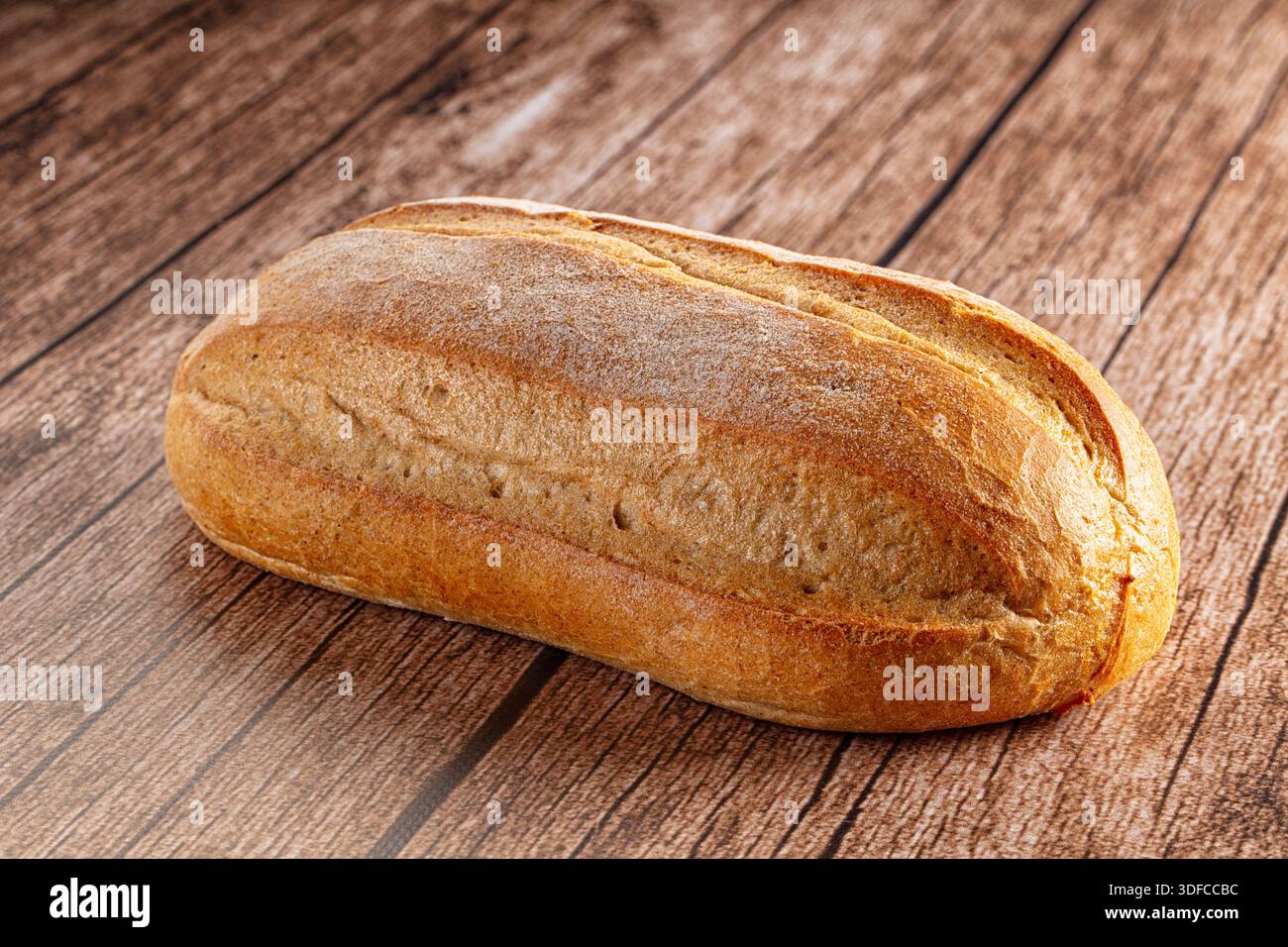Rustic crusty brown loaf bread for breakfast Stock Photo - Alamy
