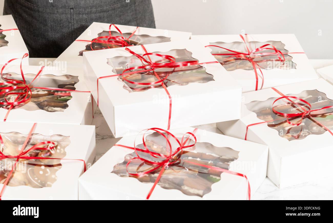 Hands Wrapping Festive Holiday Cookie Gift Box Stock Photo - Alamy