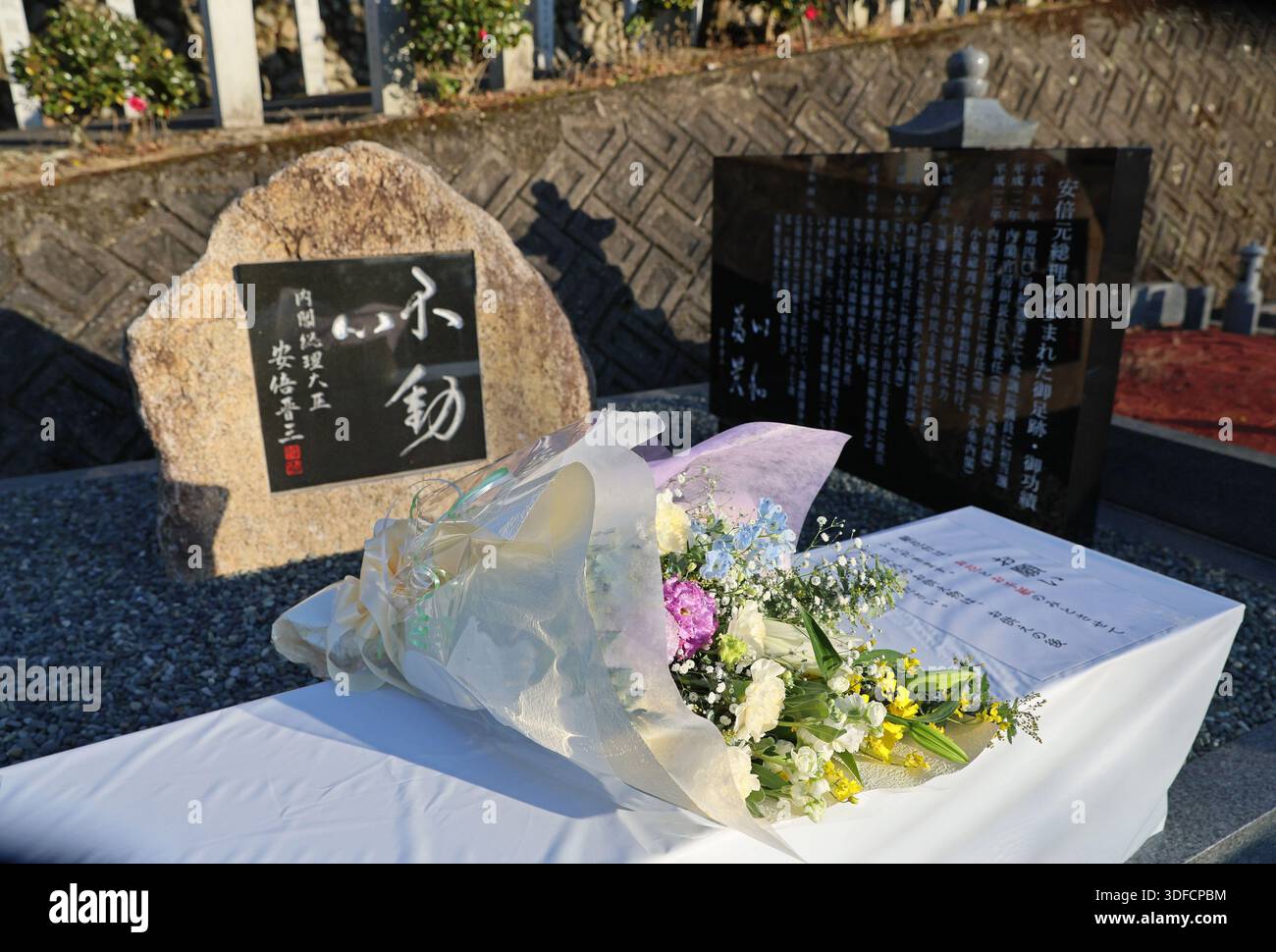 The memorial for former PM Shinzo Abe is offered a bunch of flowers by ...