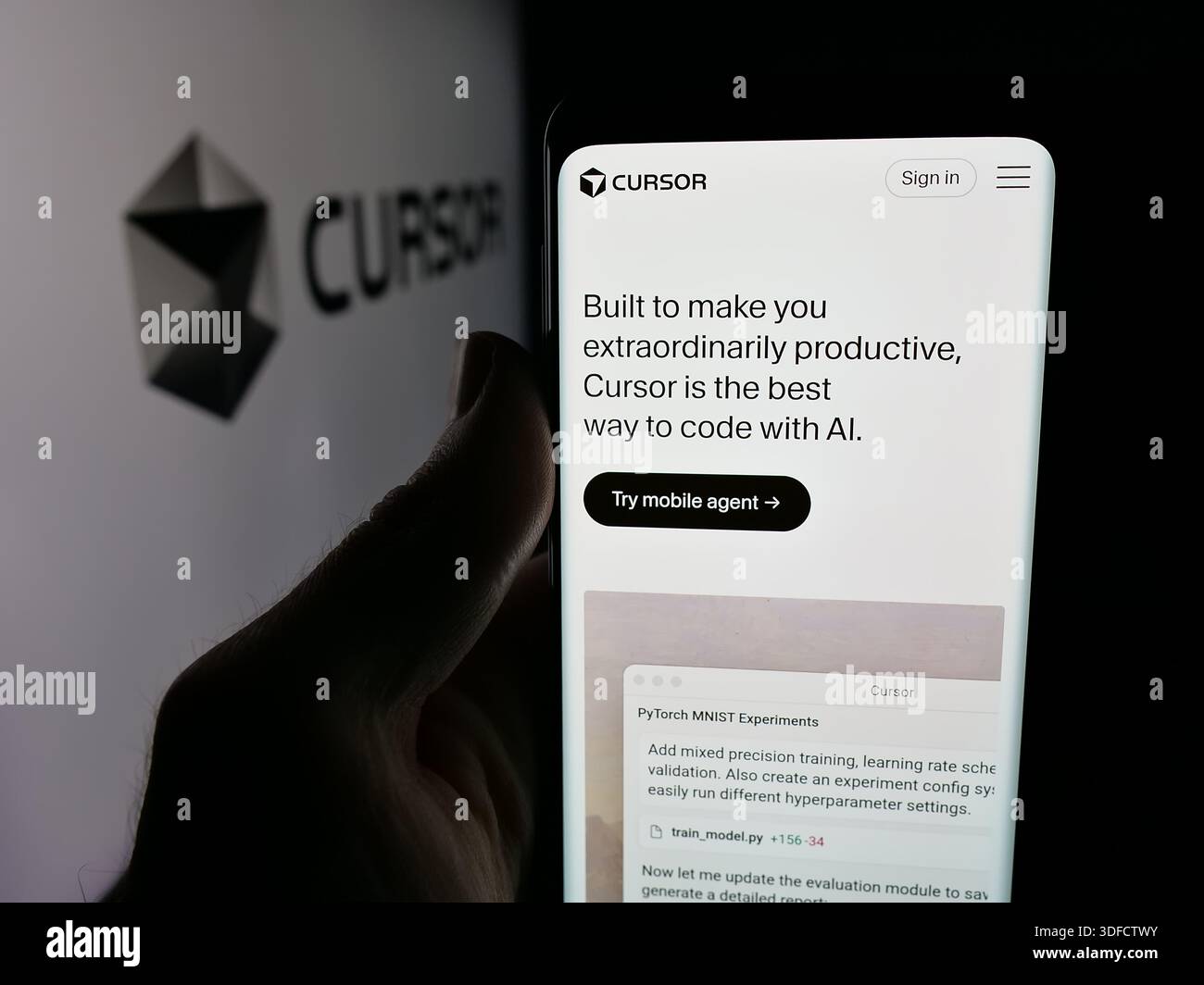 In this photo illustration, a person is holding a smartphone with the ...